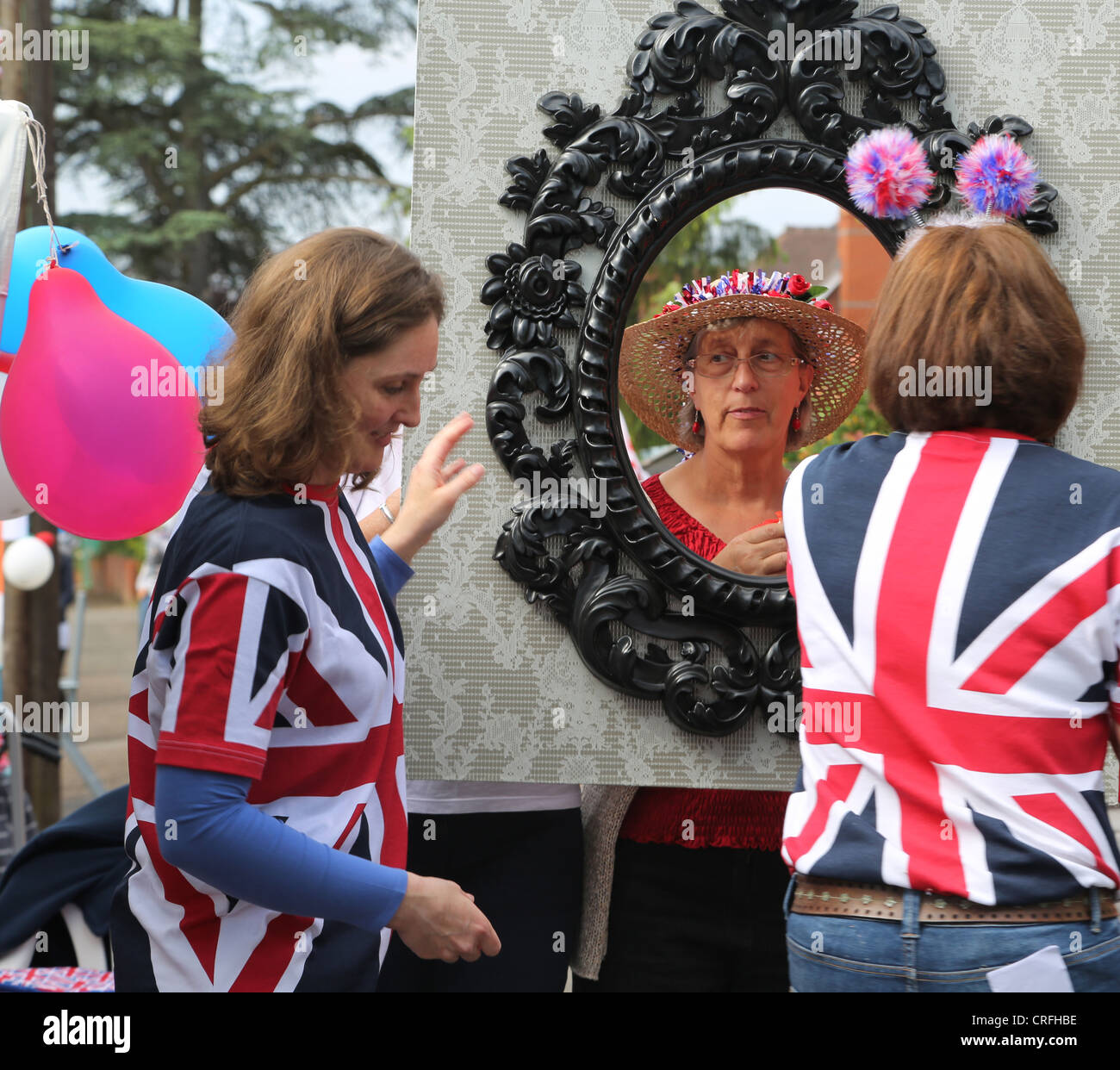 People Celebrating The Queen's Diamond Jubilee At A Street Party Women ...