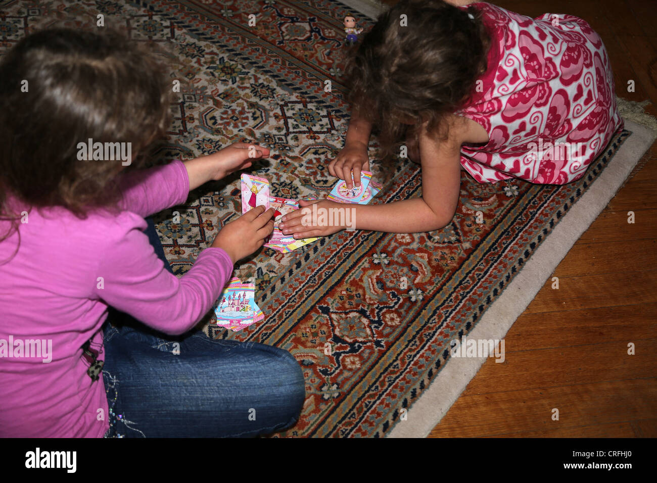 Girls Playing Card Game Snap England Stock Photo - Alamy