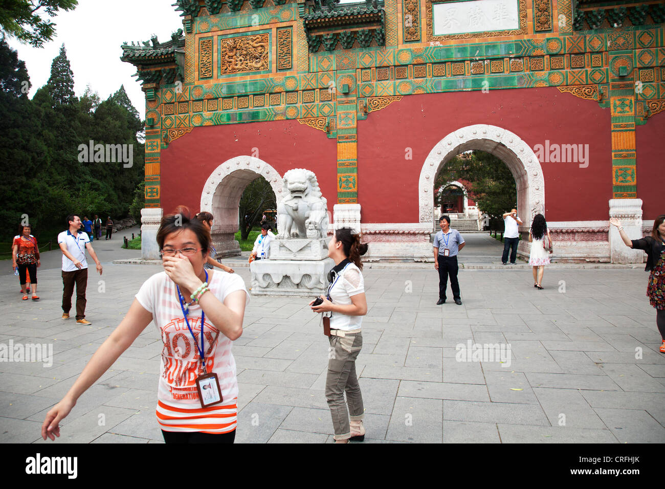 Domestic Chinese tourists laugh at a joke between one another in Beihai ...
