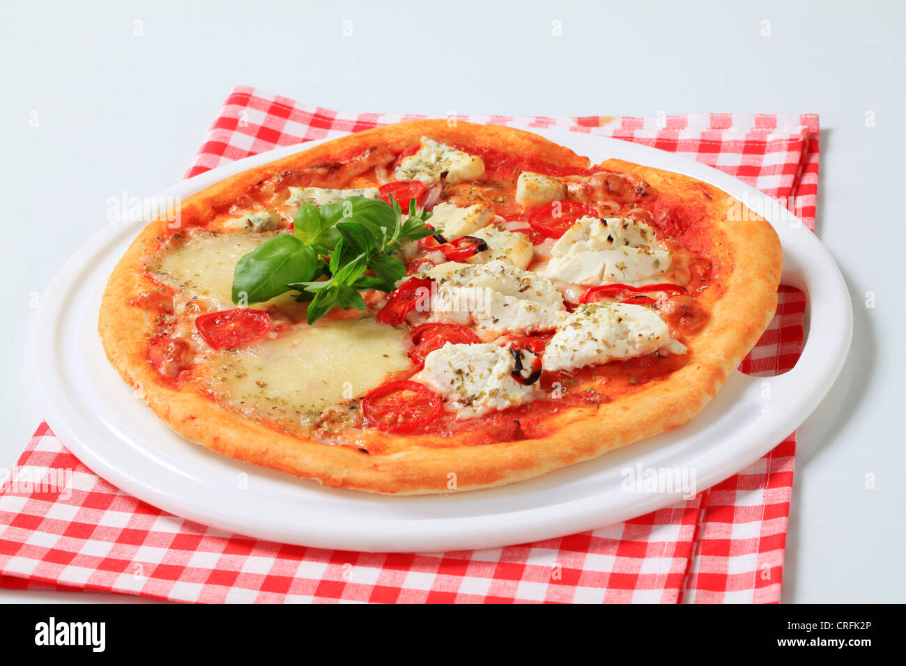 Fresh baked pizza quattro formaggi Stock Photo - Alamy