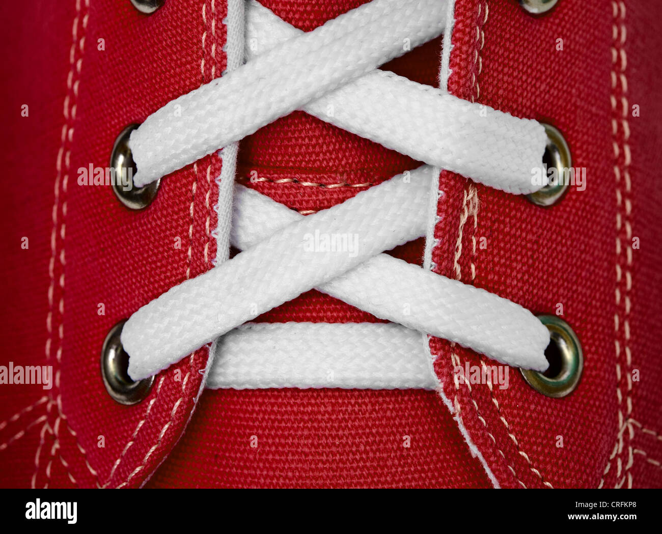 Red sneakers with white laces hi-res stock photography and images - Alamy