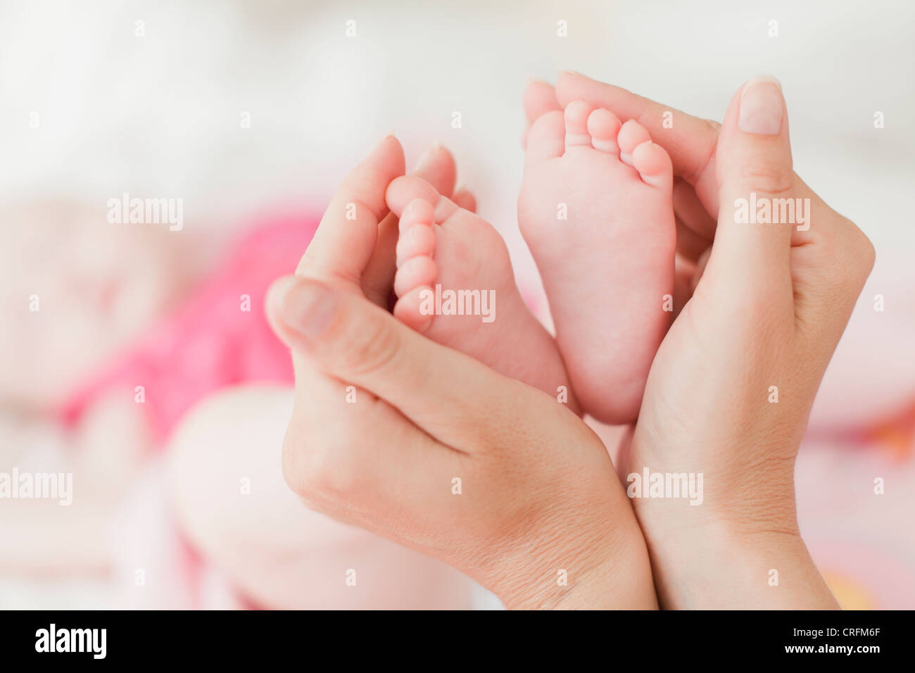 Babys hand on foot close up hi-res stock photography and images - Alamy