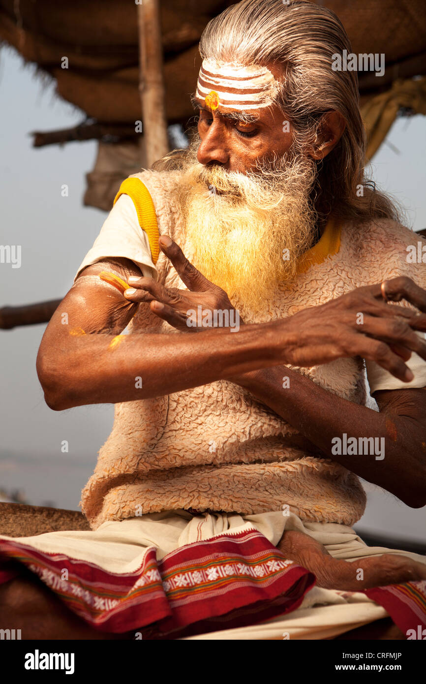 Hindu monk Sadhu show me , how to decorating himself for god, Varanasi ...