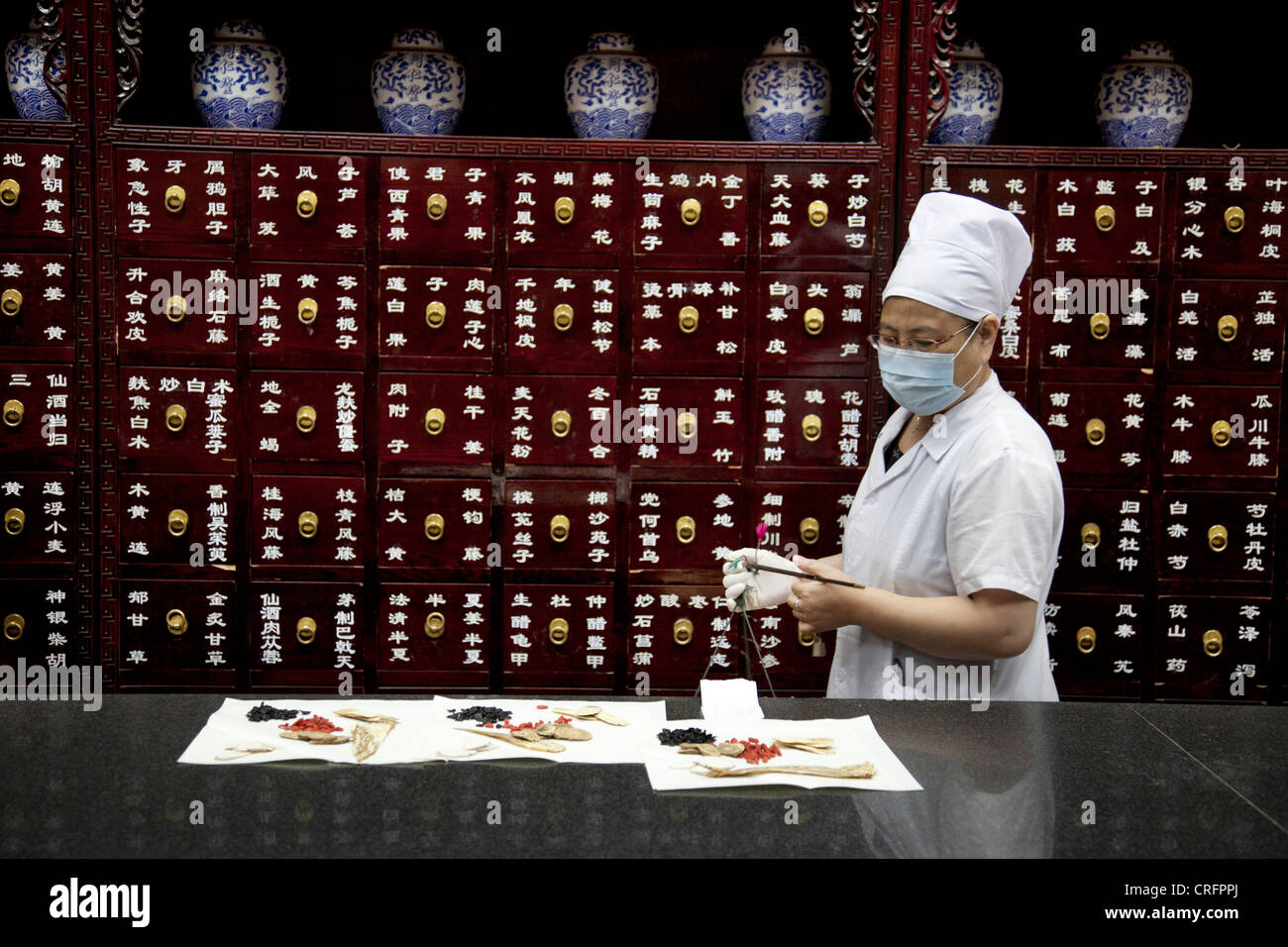 Preparation of traditional Chinese medicine at the Beijing Tongrentang ...