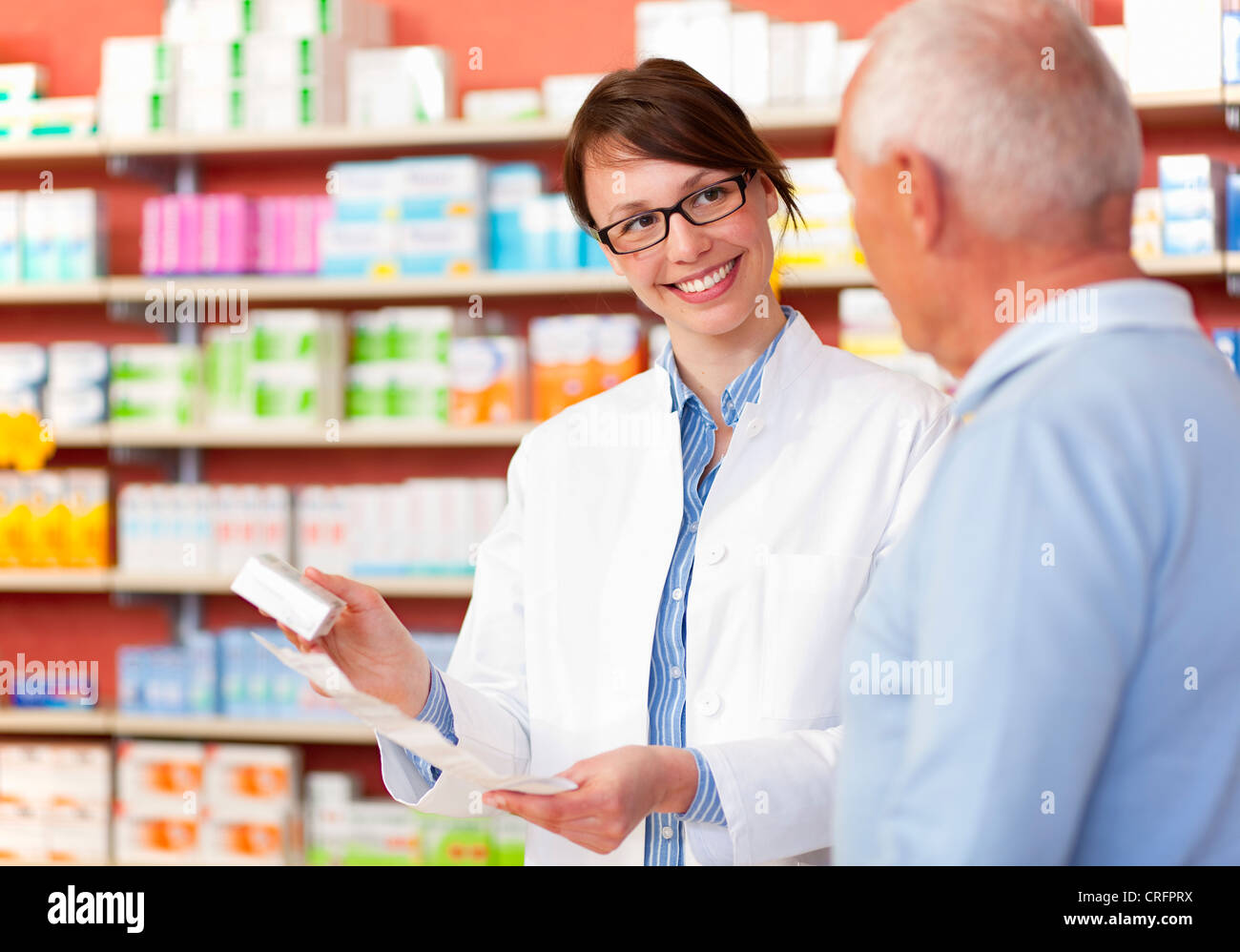 Pharmacist Talking To Patient Pharmacy First