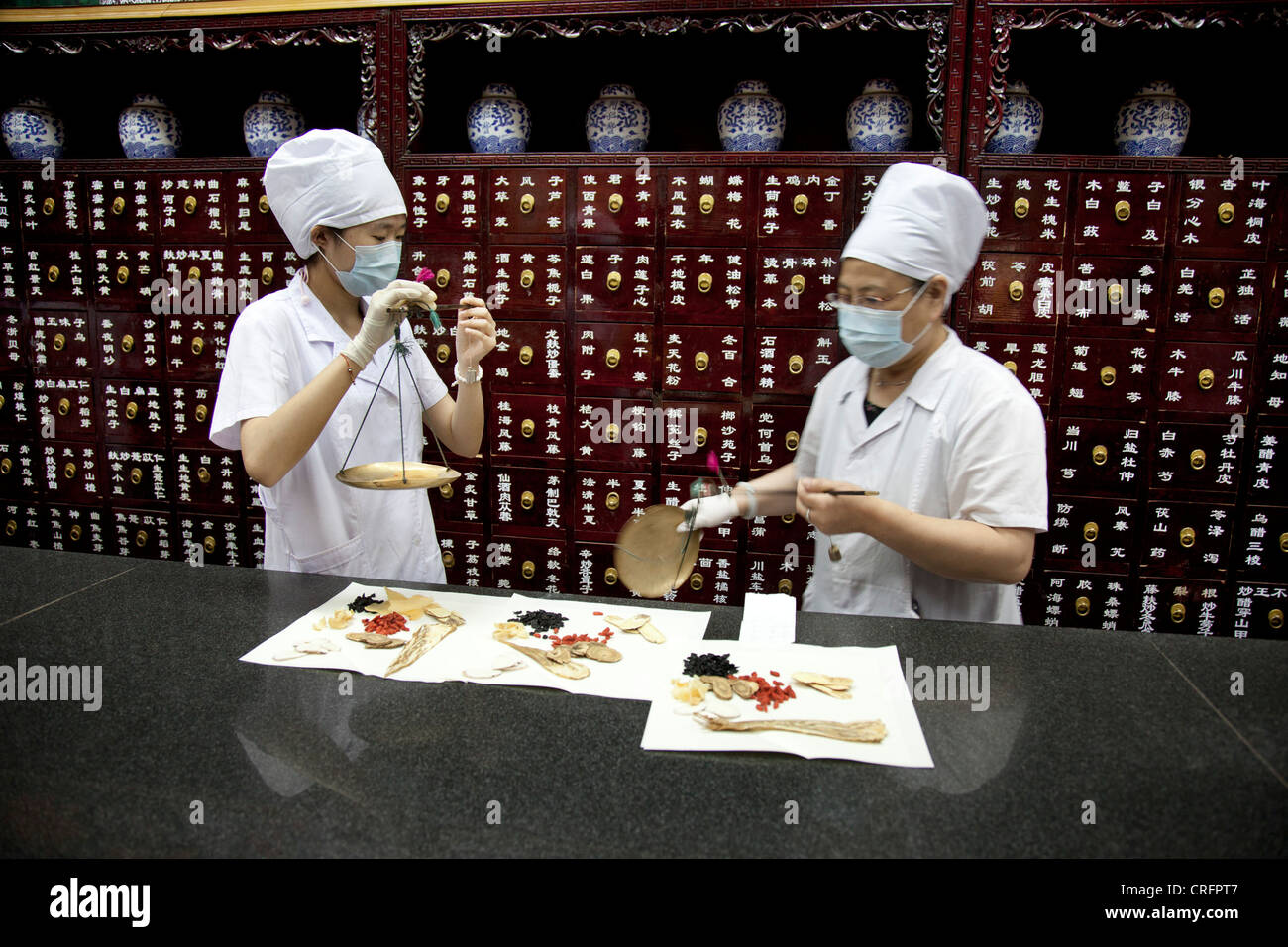 Preparation of traditional Chinese medicine at the Beijing Tongrentang ...