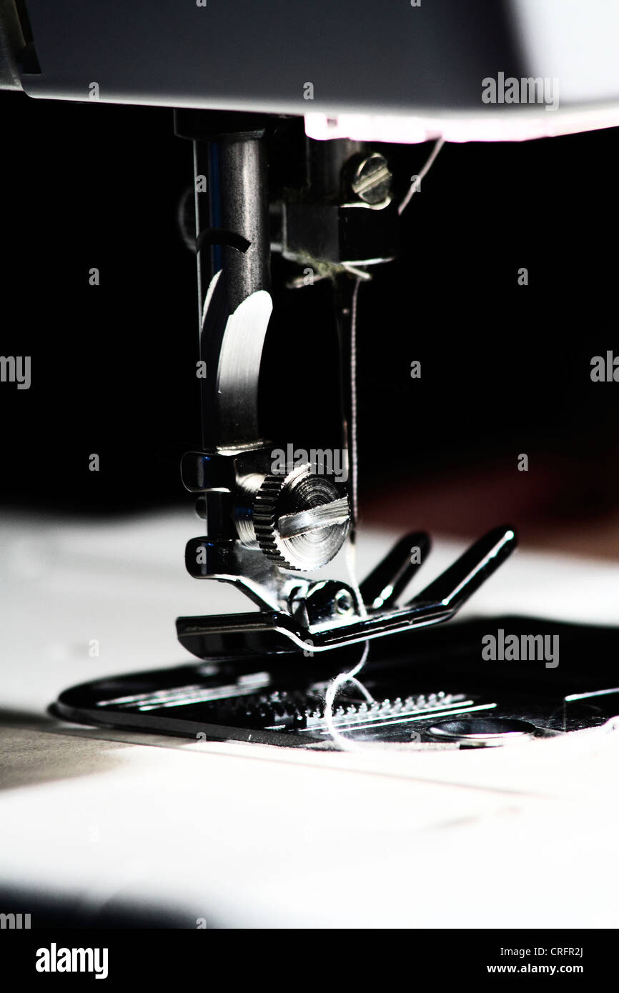 seamstress using sewing machine in their daily work Stock Photo - Alamy