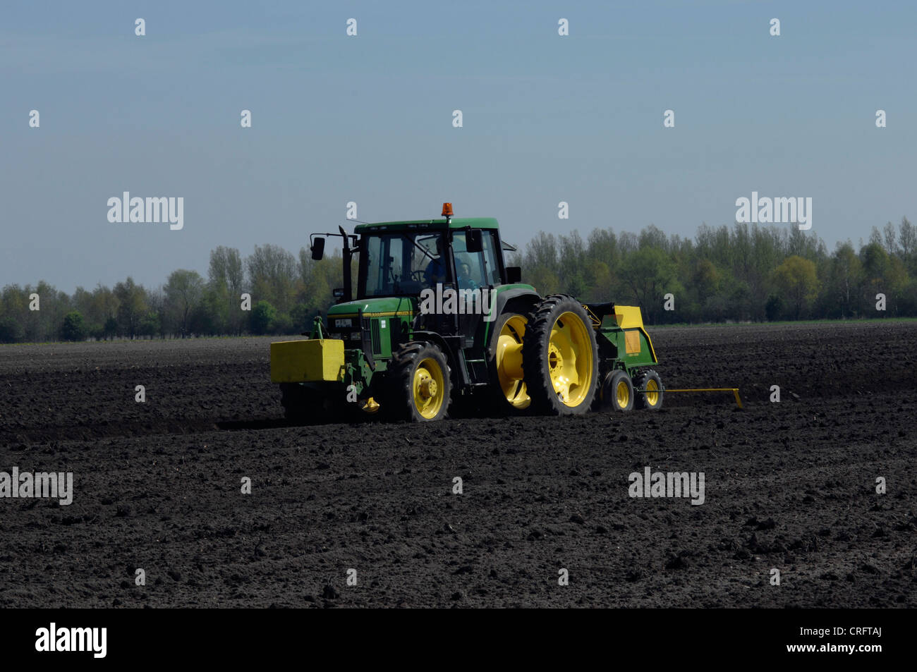 Tractor and potato planting machine hi-res stock photography and images ...
