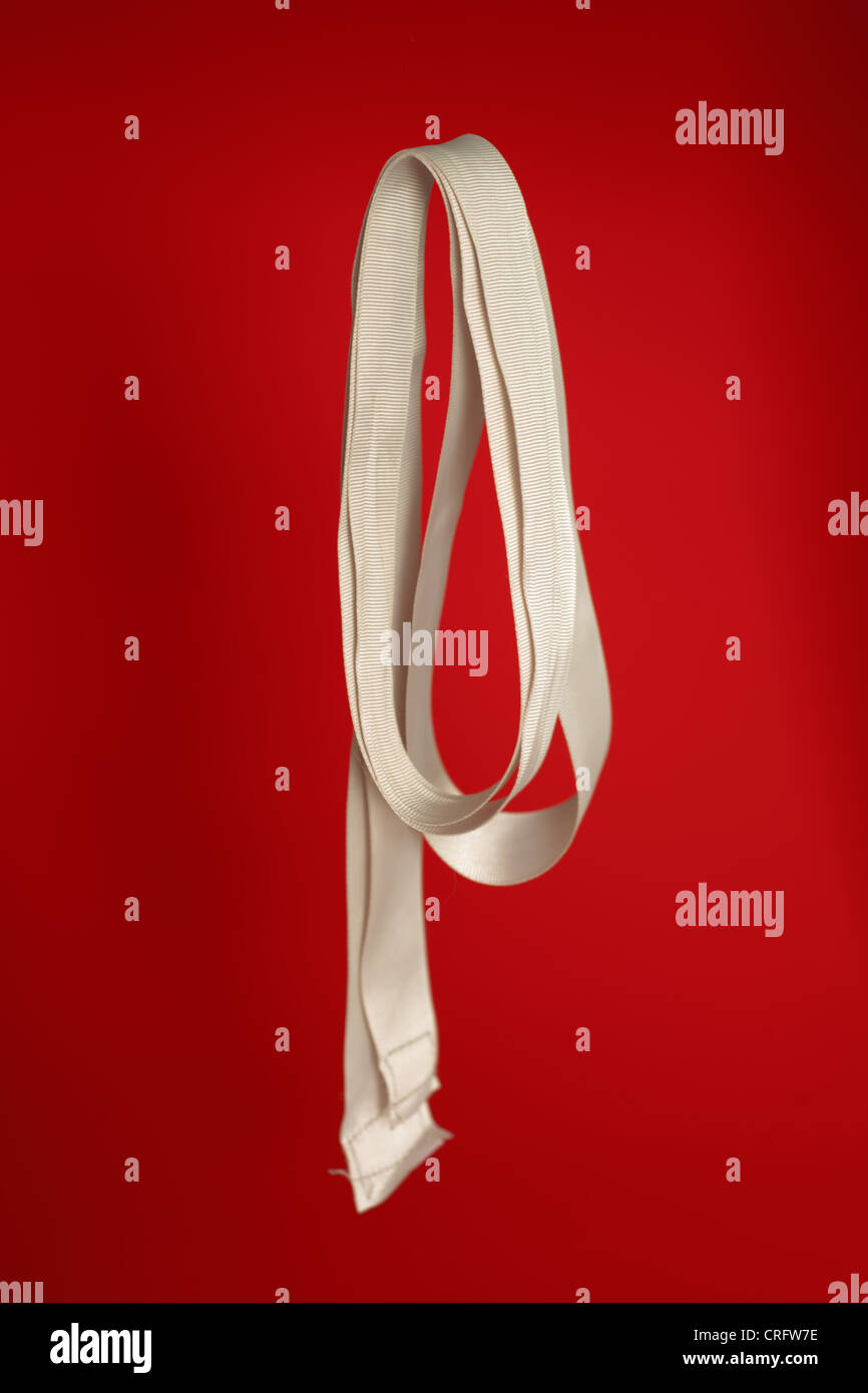 Narrow material strip used for tying a large blanket Stock Photo - Alamy