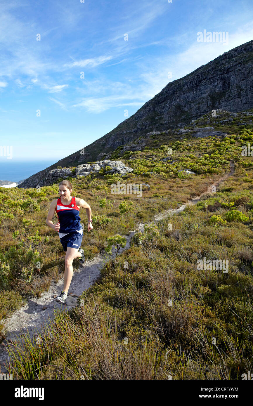 A female trailrunner in Table Mountain National Park. Cape Town, South ...