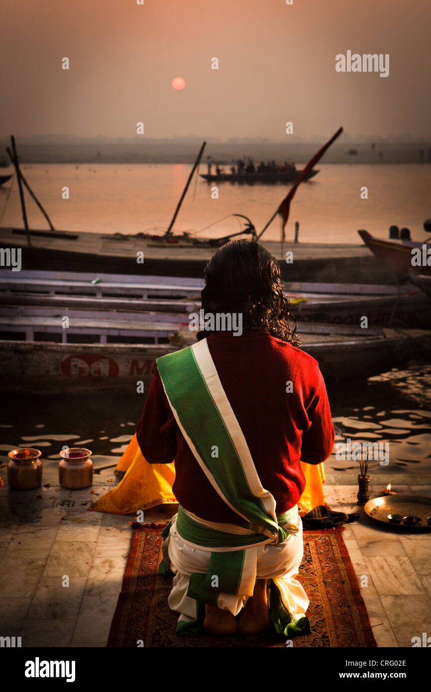 Hindu monk (Brahman) pray for sunrise in Ganga river(Ganges), Varanasi ...