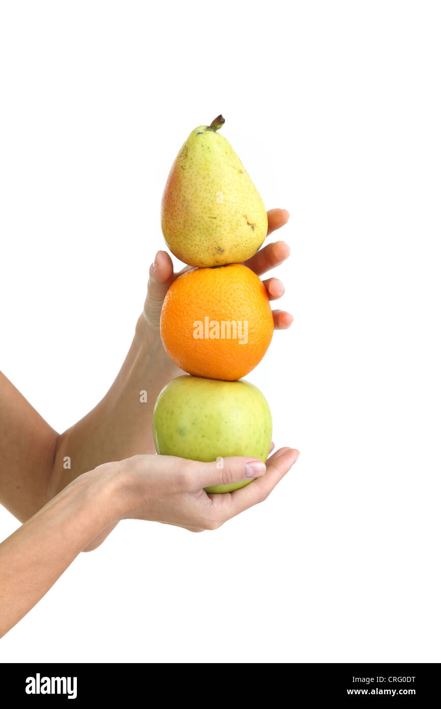 fruit pile in woman hands on white Stock Photo - Alamy