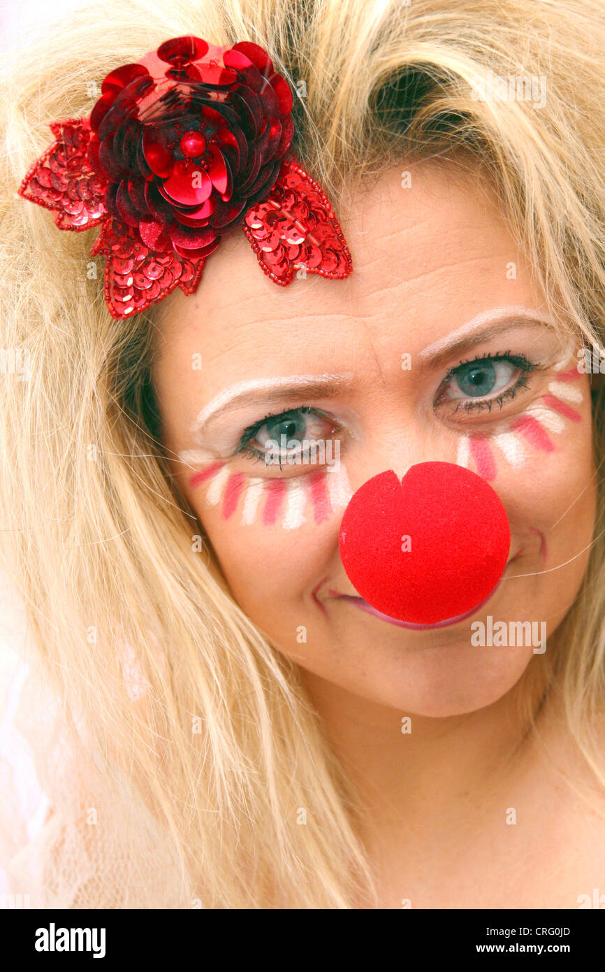 rouged blond woman with red nose Stock Photo - Alamy