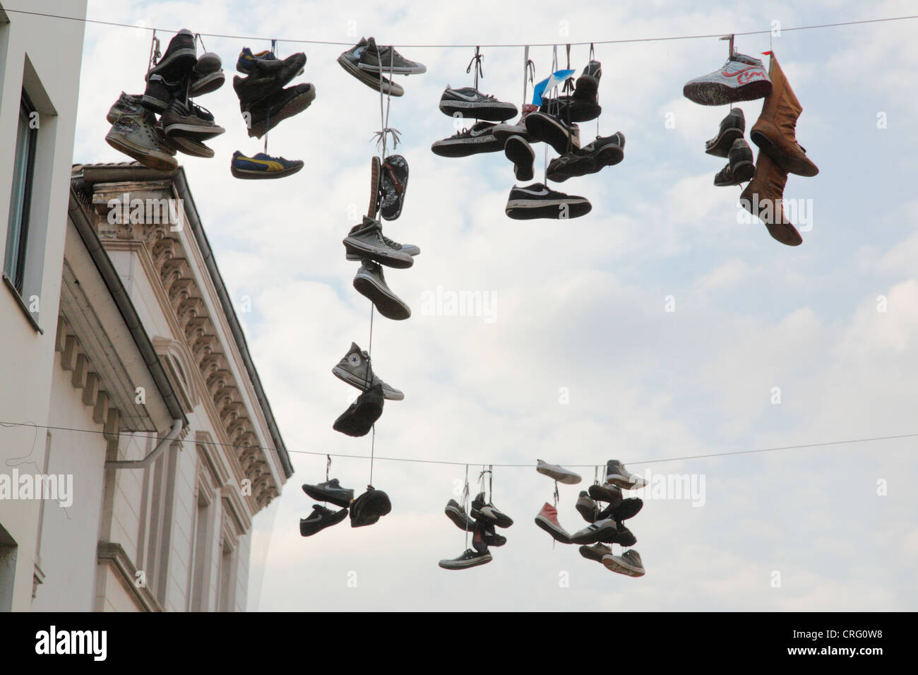 Sneakers hanging telephone wire hi-res stock photography and images - Alamy