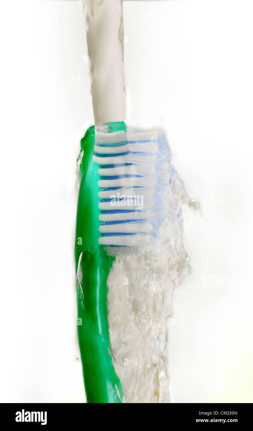 Running a toothbrush hi-res stock photography and images - Alamy