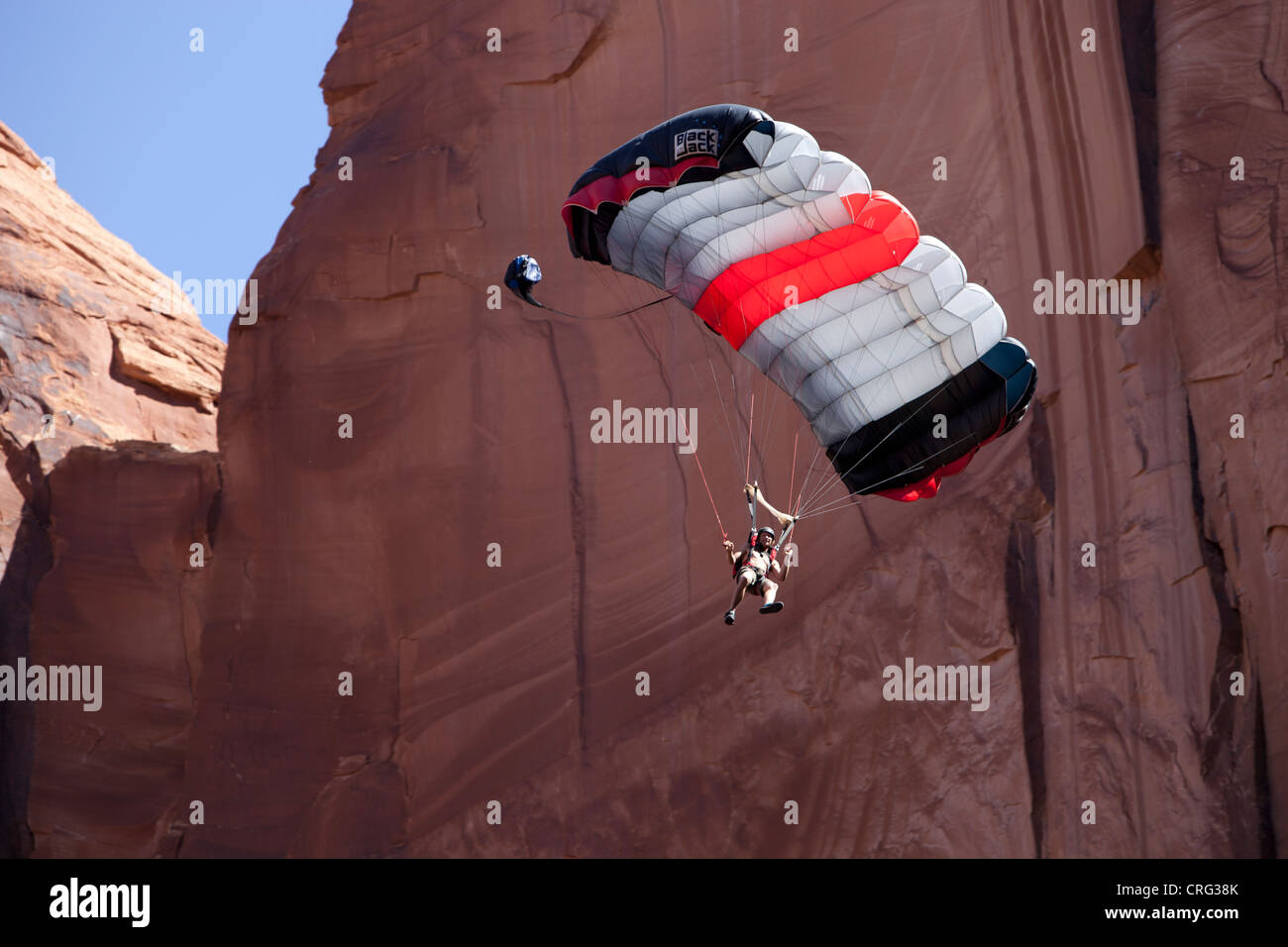 Andy Lewis base jumping off the Tombstone, Moab Utah Stock Photo - Alamy
