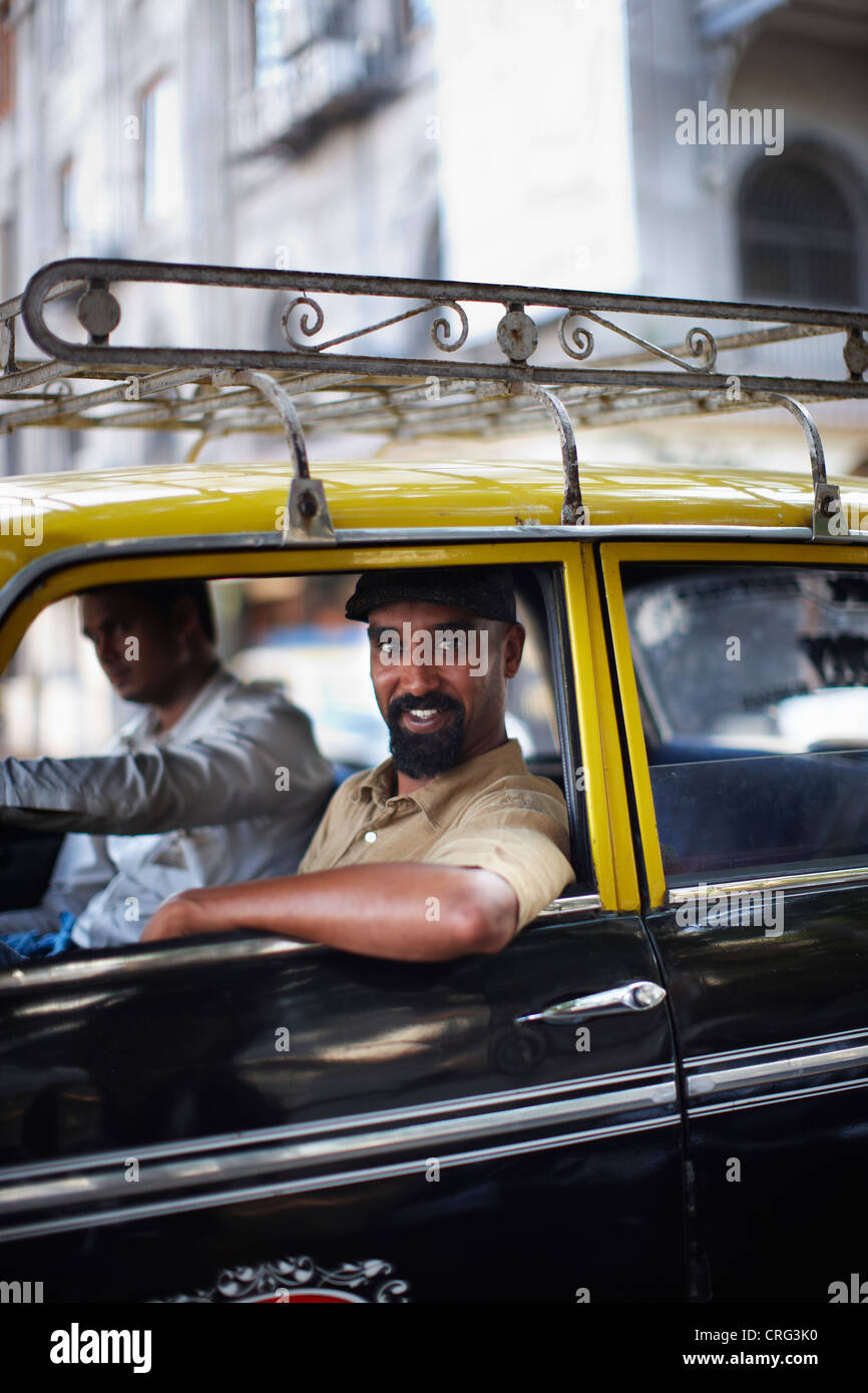 Smiling man riding in taxi cab Stock Photo - Alamy