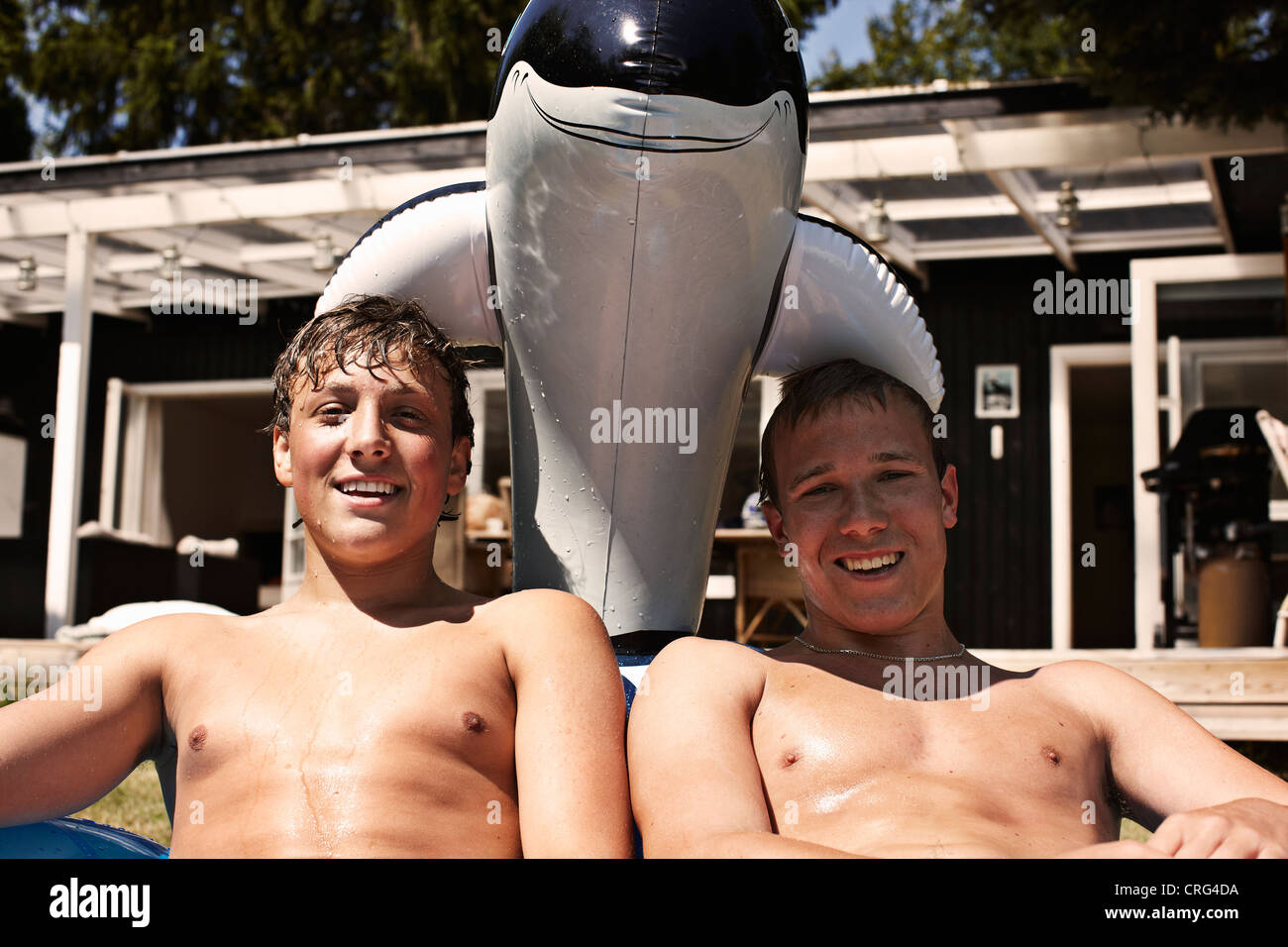 Teenage boys relaxing together outdoors Stock Photo - Alamy