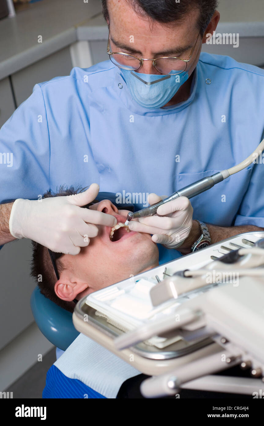 Dentist dental treatment Stock Photo - Alamy