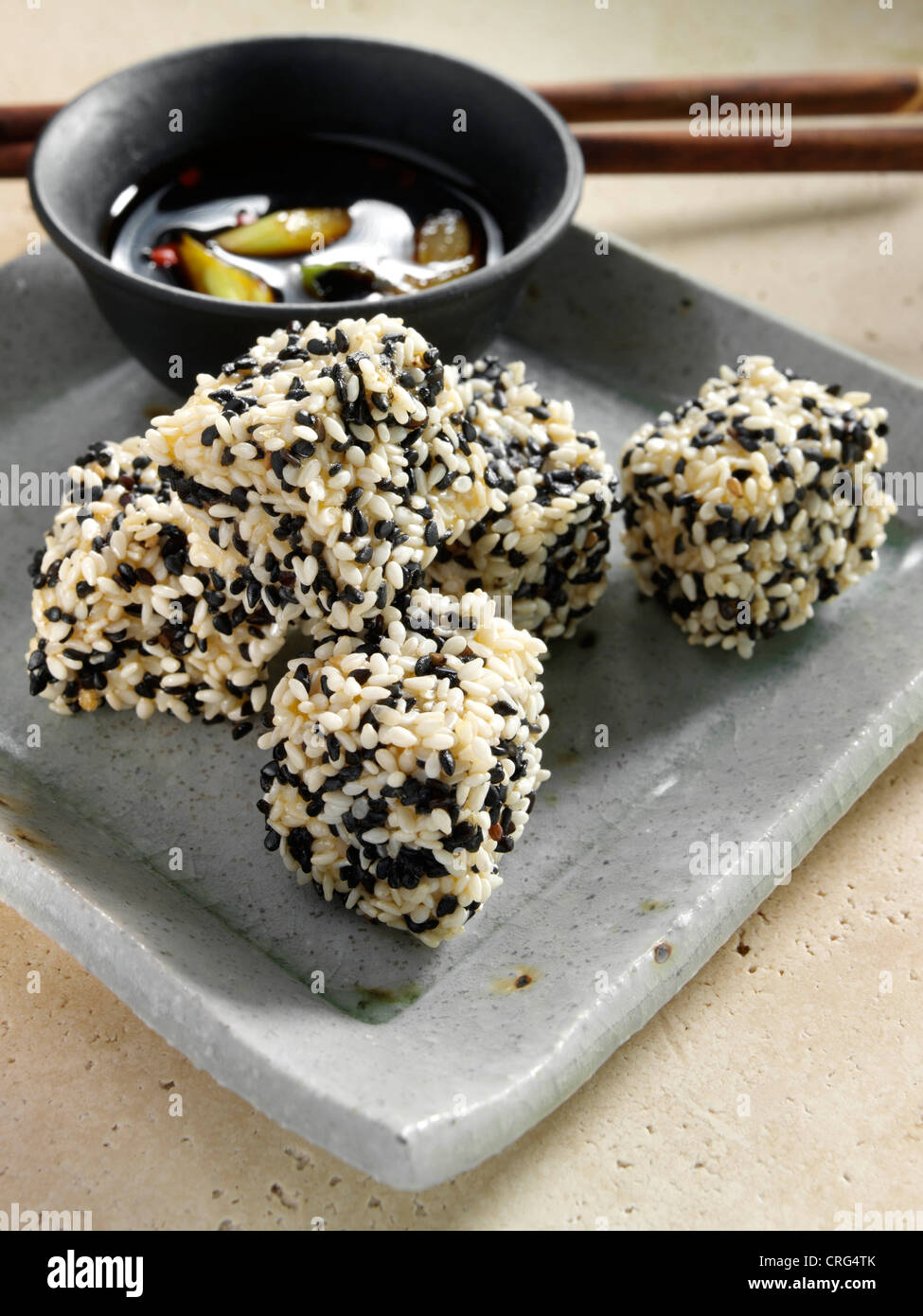 Deep fried sesame seed coated tofu dipping sauce hi-res stock ...
