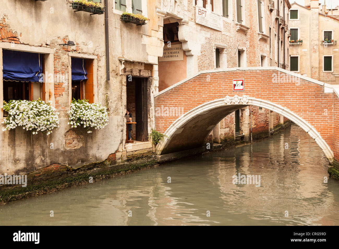 An attractive bridge over a small canal in Venice, Italy Stock Photo ...