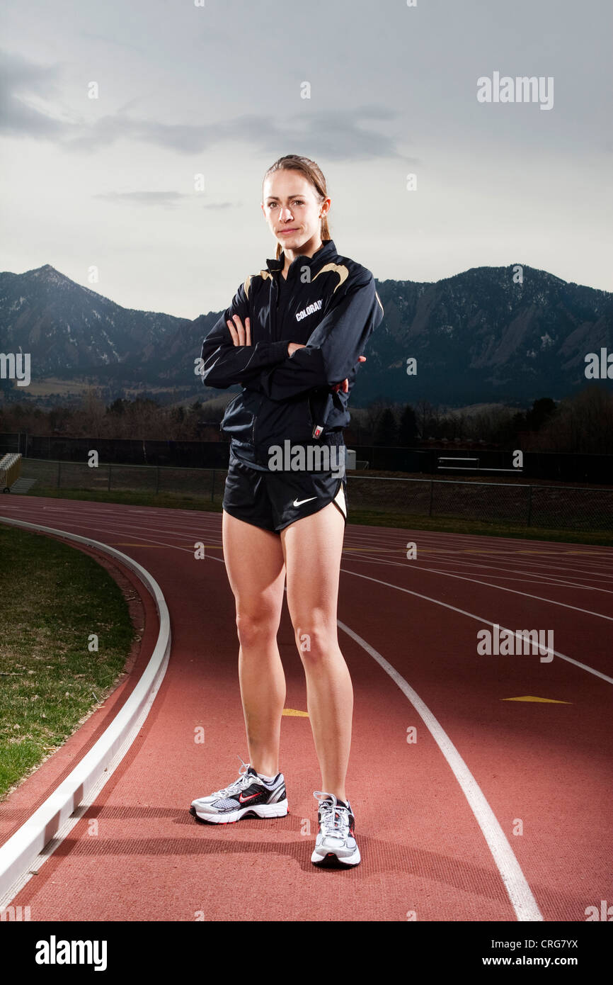 A portrait of a female athlete posing on a track Stock Photo - Alamy