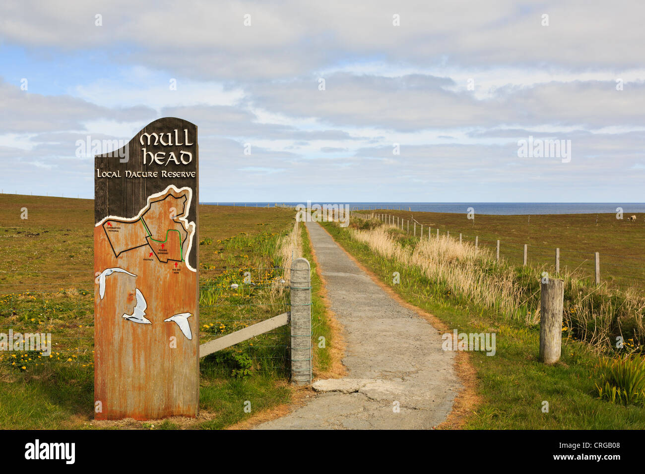 Mull Head local nature reserve sign by path to The Gloup, a collapsed ...