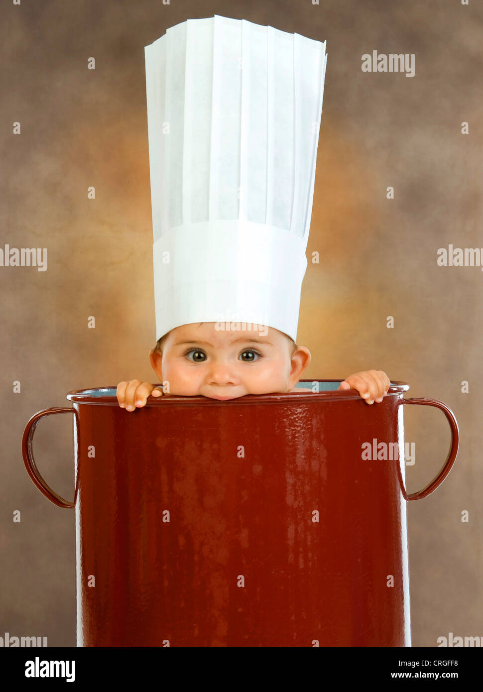 little child with chef's cap in cooking pot Stock Photo - Alamy