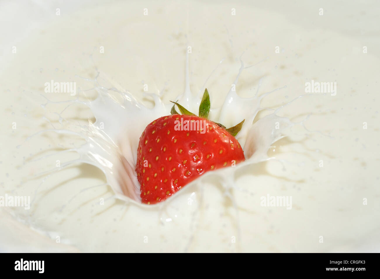 strawberry falling into milk Stock Photo - Alamy