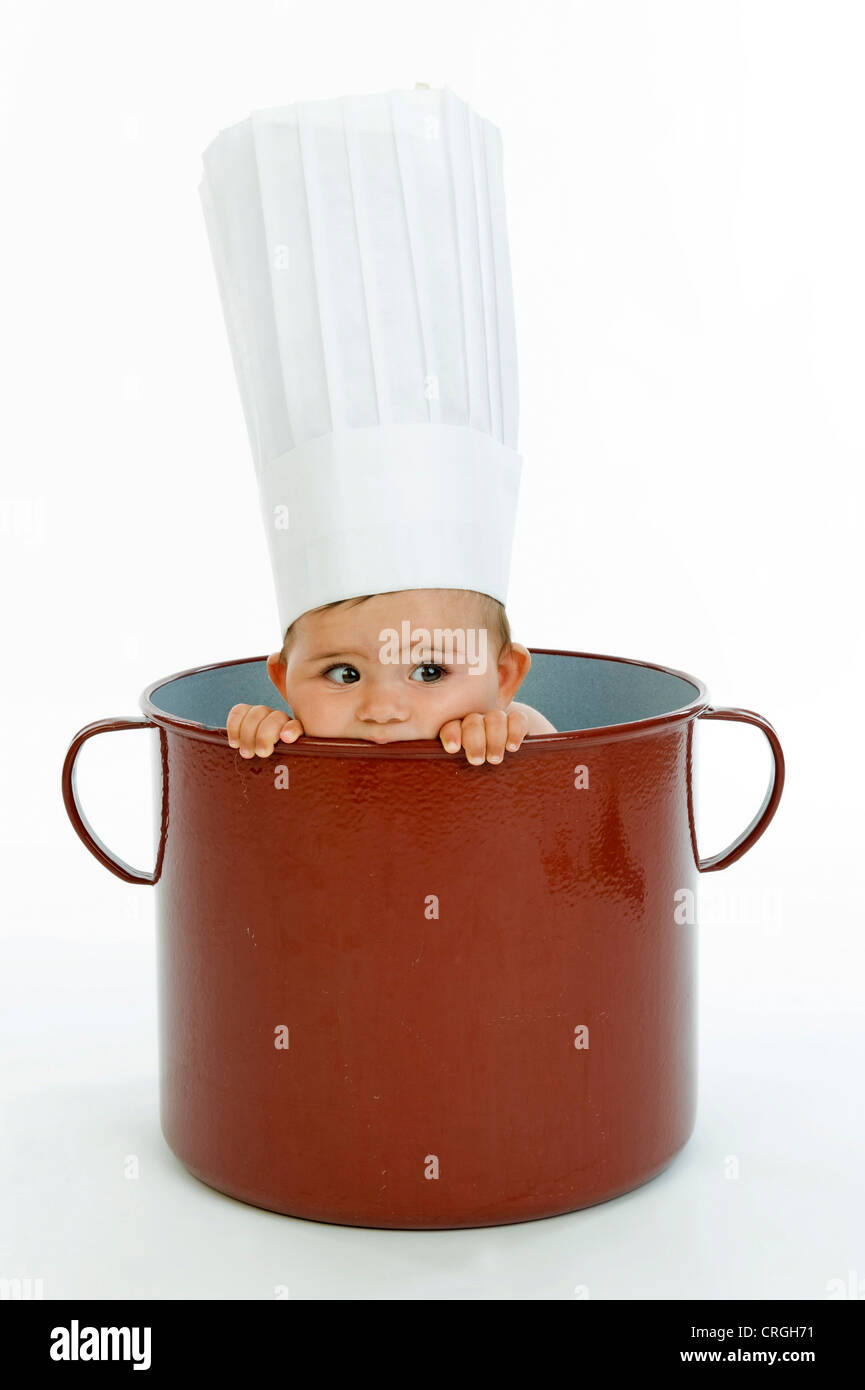 little child with chef's cap in cooking pot Stock Photo - Alamy
