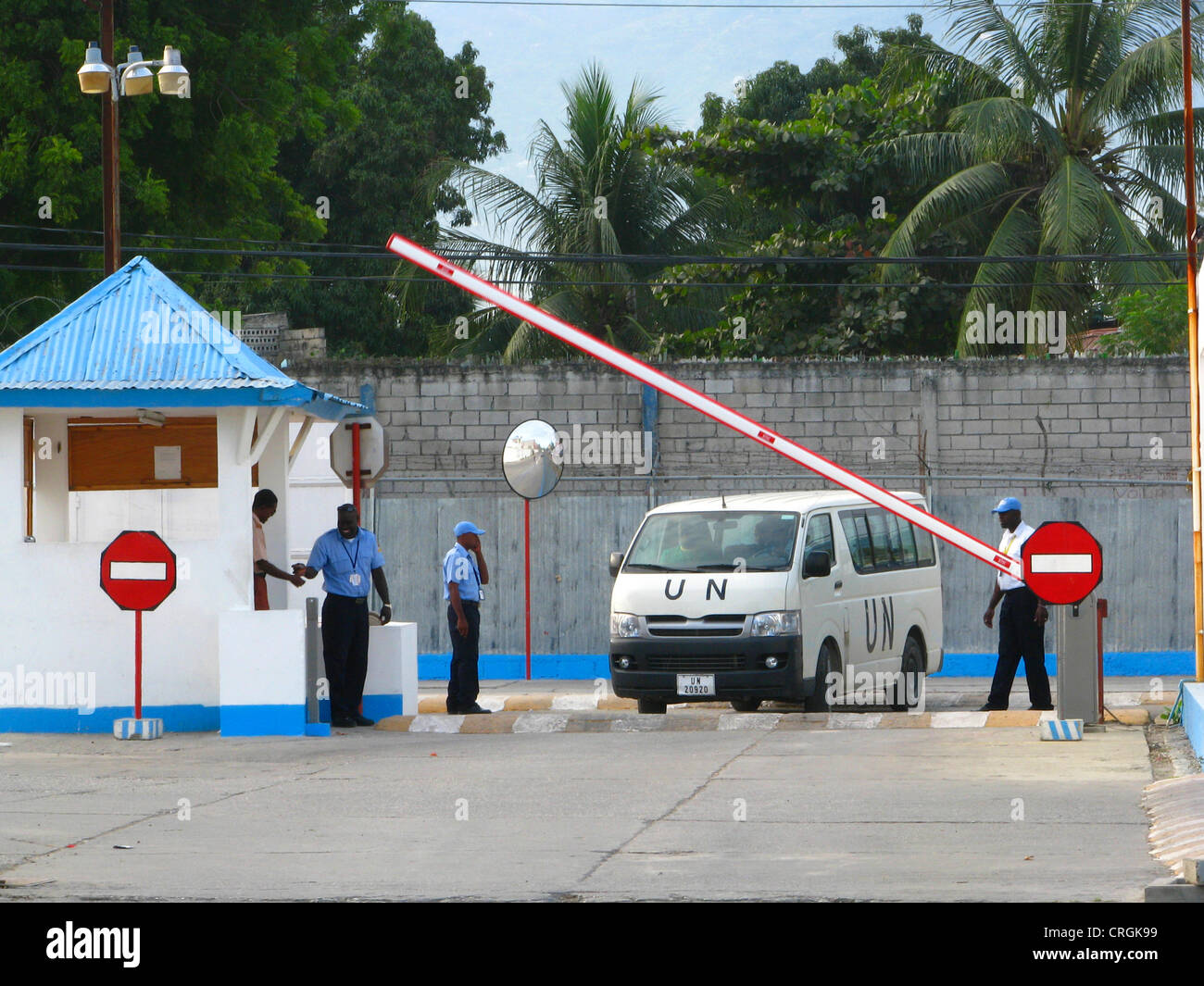 UN vehicle passes guarded check point with barrier in headquarter Stock ...