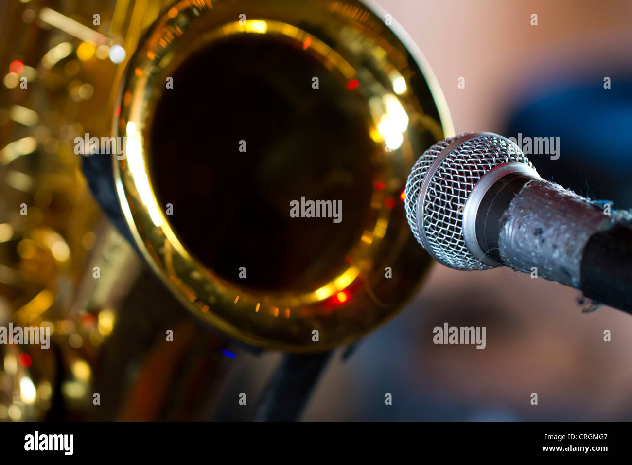 A saxophone playing into a microphone Stock Photo - Alamy