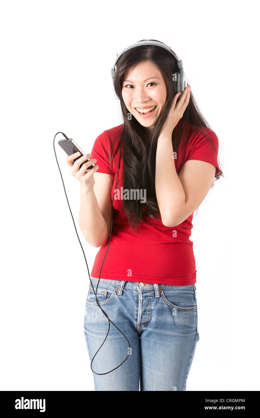 Happy Asian woman listening to Music Stock Photo - Alamy
