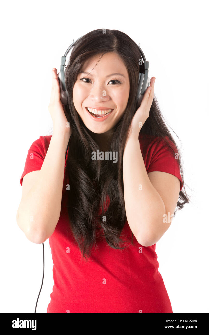 Happy Asian woman listening to Music Stock Photo - Alamy