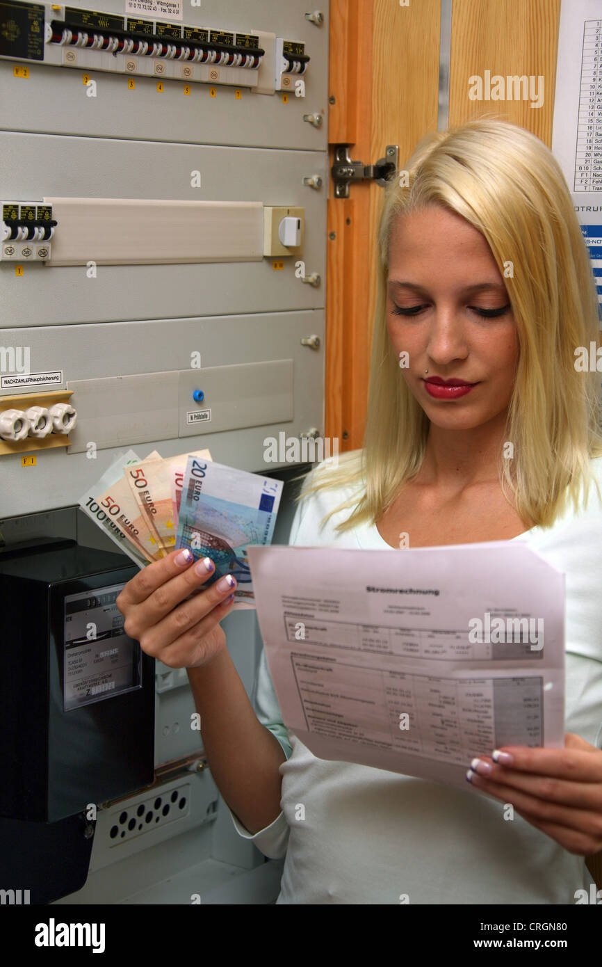 Woman reading energy meter hi-res stock photography and images - Alamy