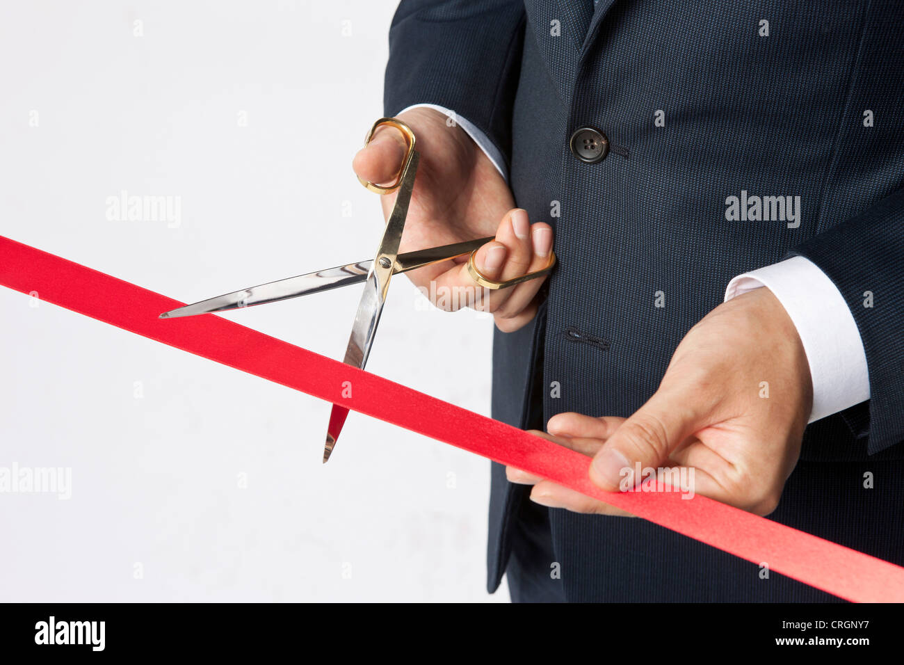 Person cutting red ribbon adult man hi-res stock photography and images ...