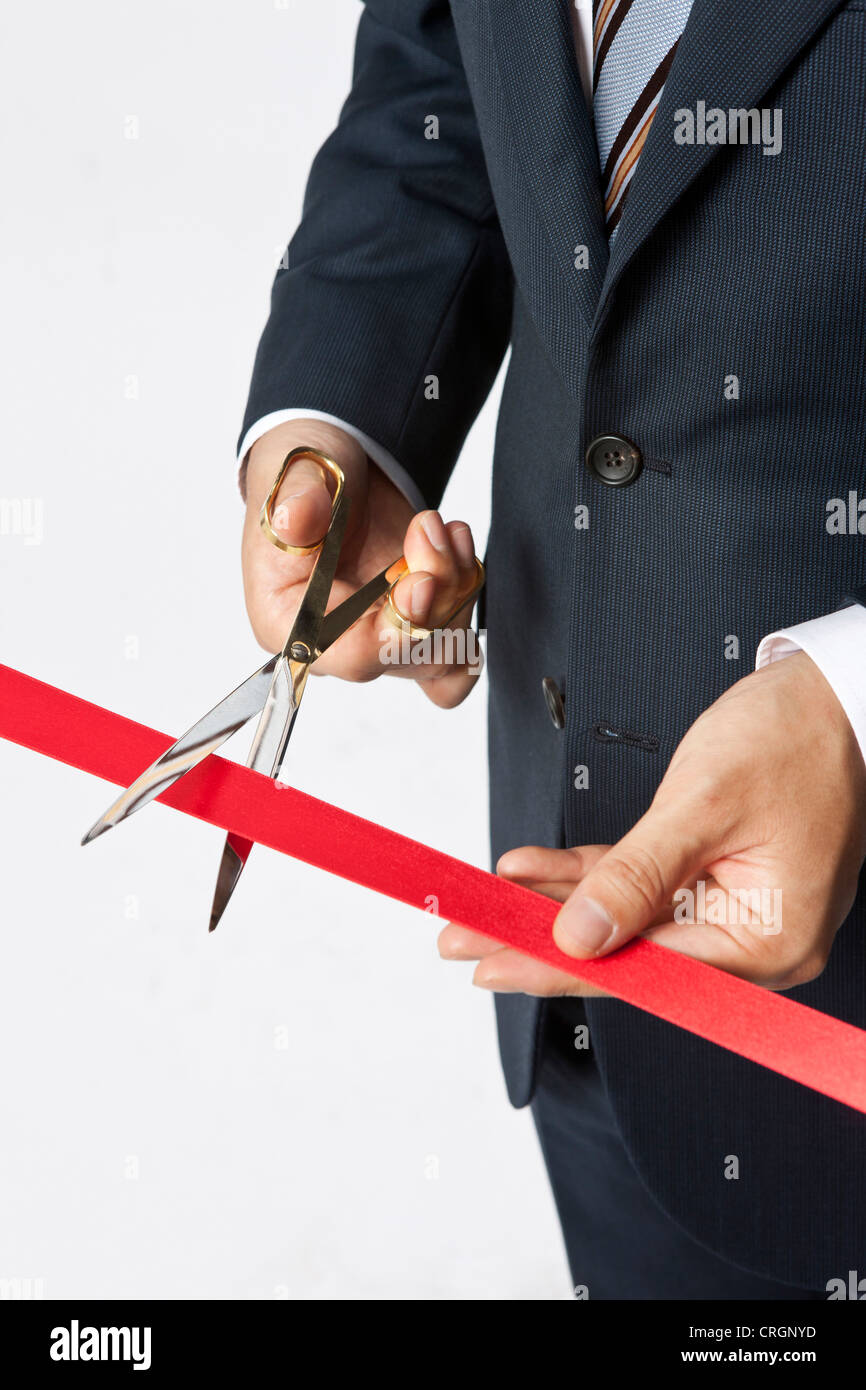 Person cutting red ribbon adult man hi-res stock photography and images ...