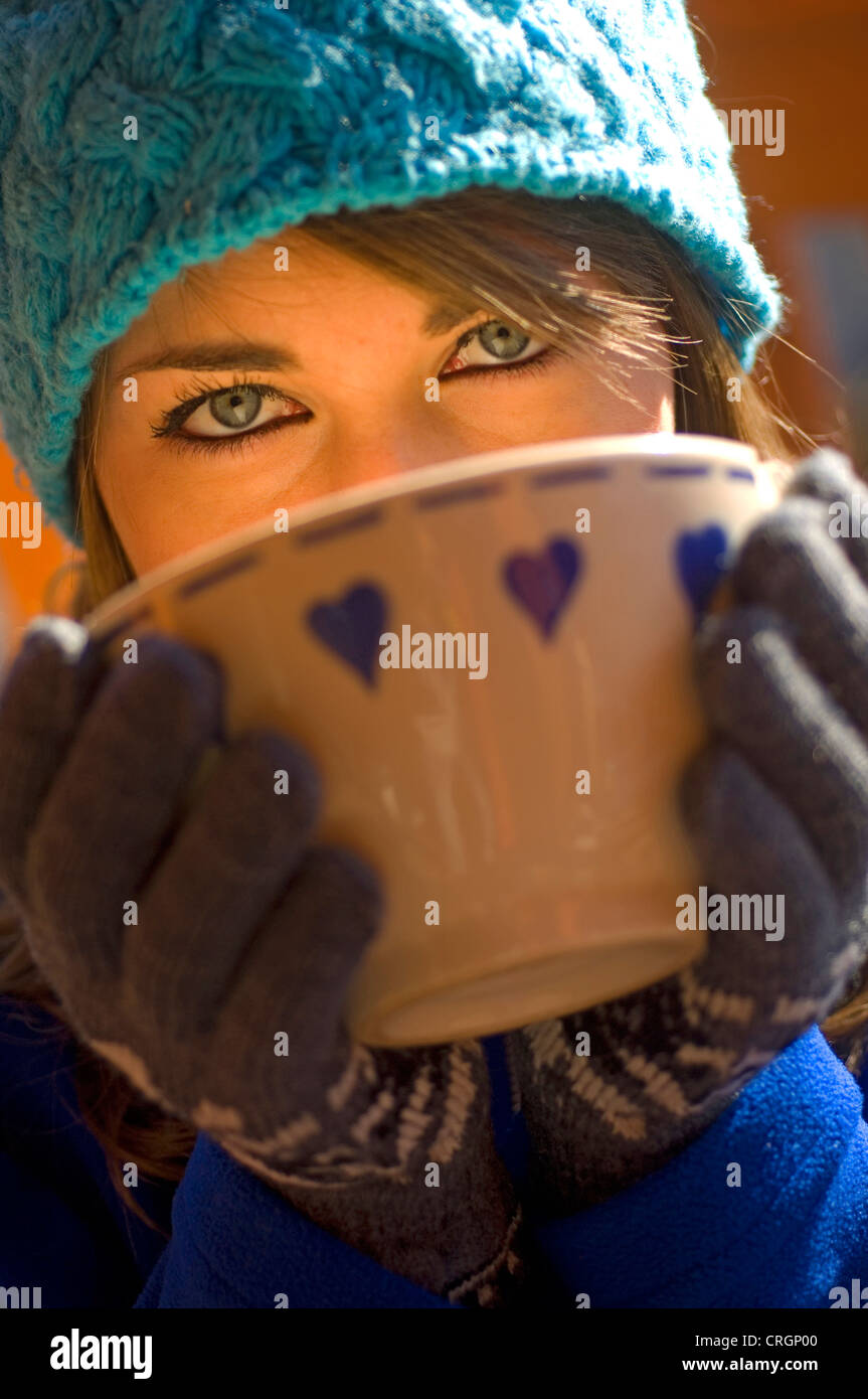 woman warming up with hot chocolate in a cup in winter Stock Photo - Alamy
