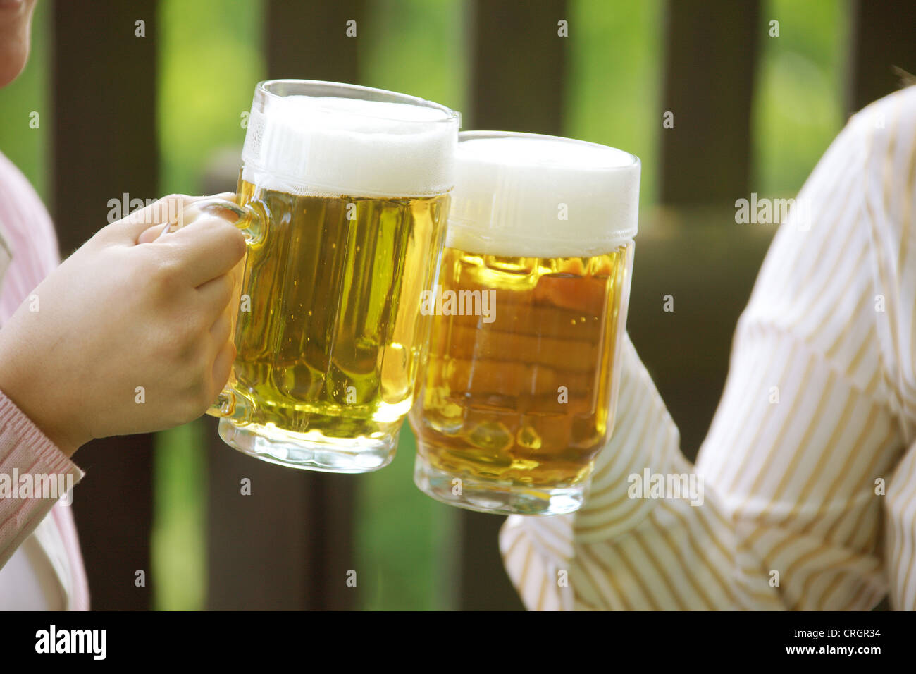 drink a toast with beer Stock Photo - Alamy