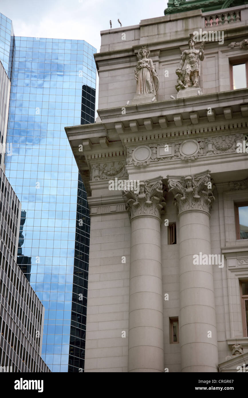 old building in front of modern high-rise buildings, USA, New York City ...