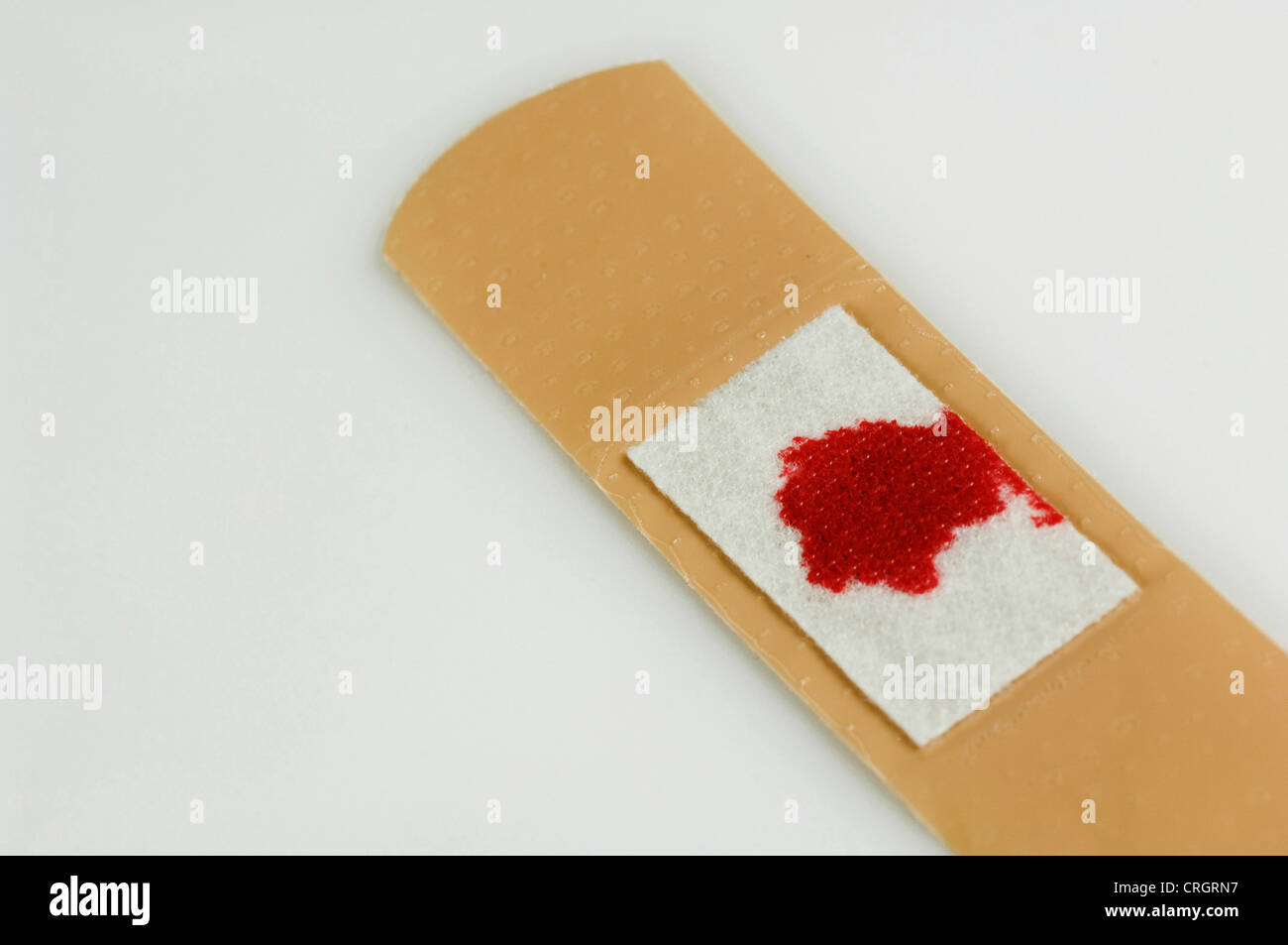 used adhesive plaster with bloodstain Stock Photo - Alamy
