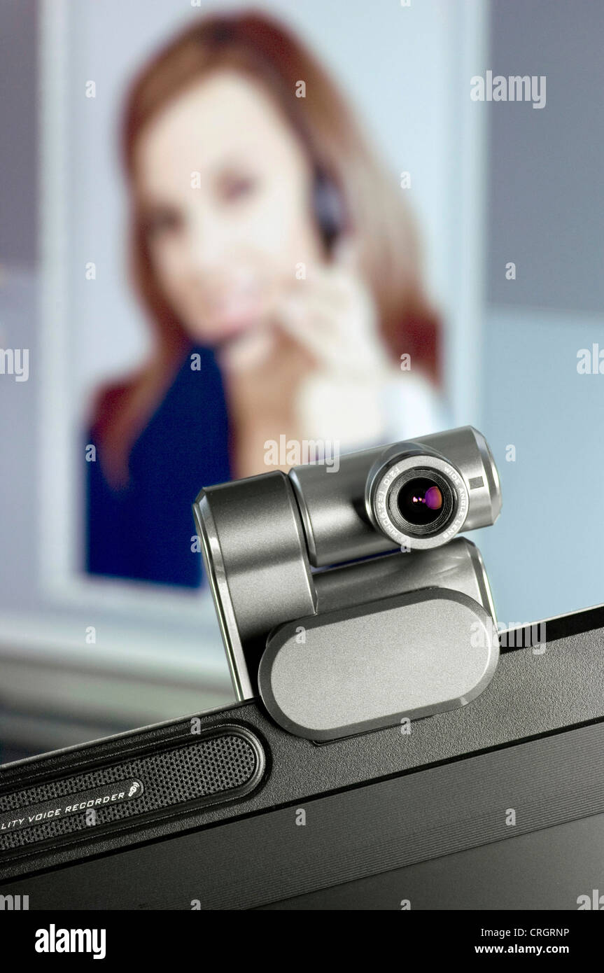 webcam installed on computer monitor, portrait of a woman in the ...