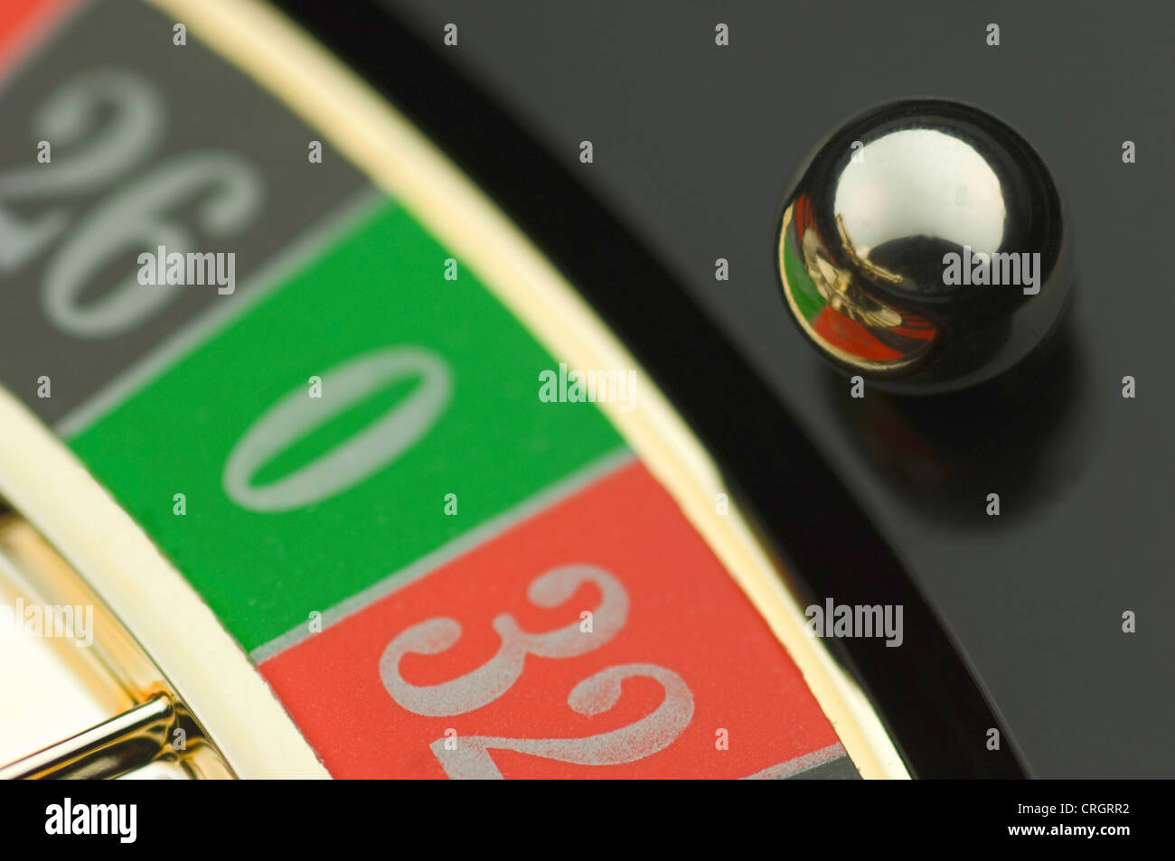 part of roulette wheel with ball near zero Stock Photo - Alamy