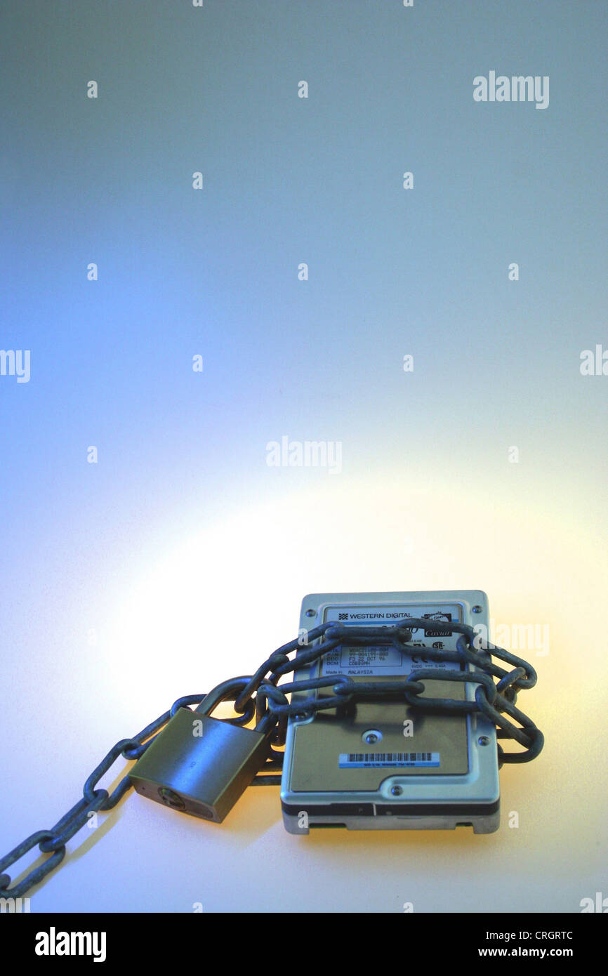 computer safety: chain with lock at harddisk Stock Photo - Alamy