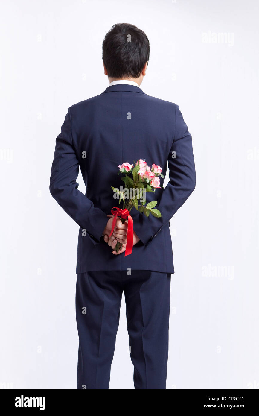 Man suit behind back studio hi-res stock photography and images - Alamy