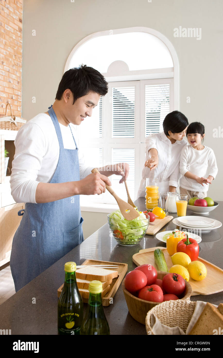 Father cooking for his family Stock Photo - Alamy