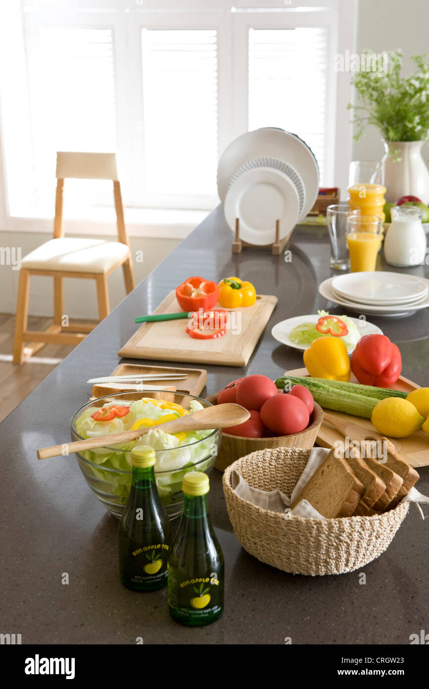 Various vegetables on kitchen counter Stock Photo - Alamy