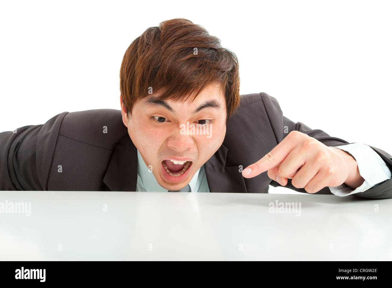 angry businessman pointing something on the table Stock Photo - Alamy