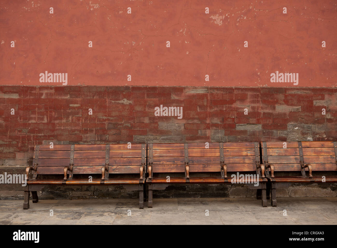Row of benches in front of a wall at Forbidden City, Beijing, China ...