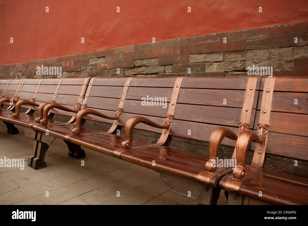 Row of benches in front of a wall at Forbidden City, Beijing, China ...
